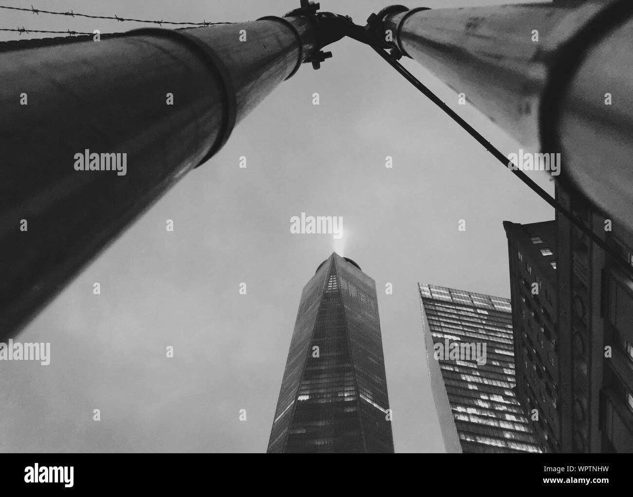 Skyscraper Seen From Between Fence Poles Stock Photo - Alamy