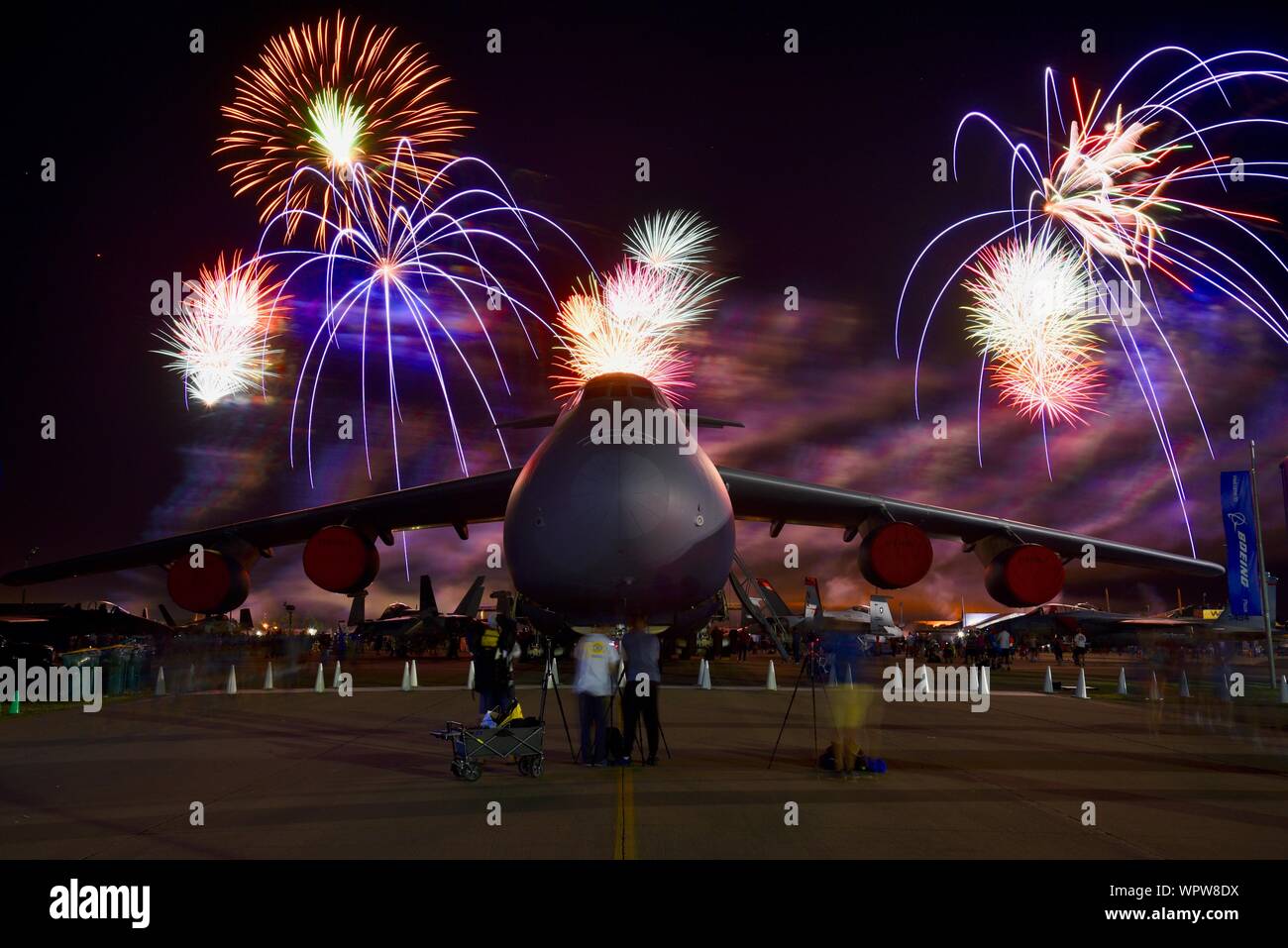Spectacular fireworks explode behind massive Lockheed C-5M Super Galaxy ...
