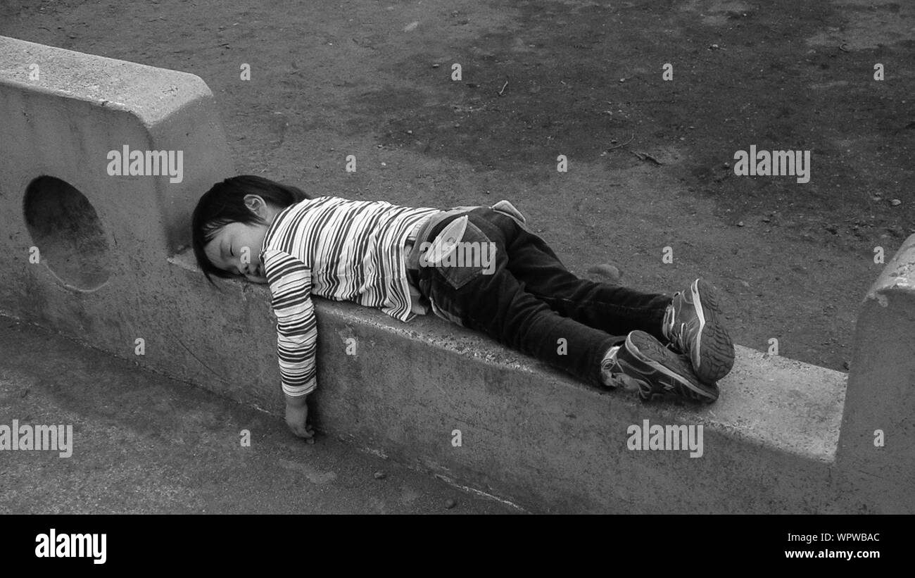 Boy Lying Down Wall High Resolution Stock Photography and Images - Alamy