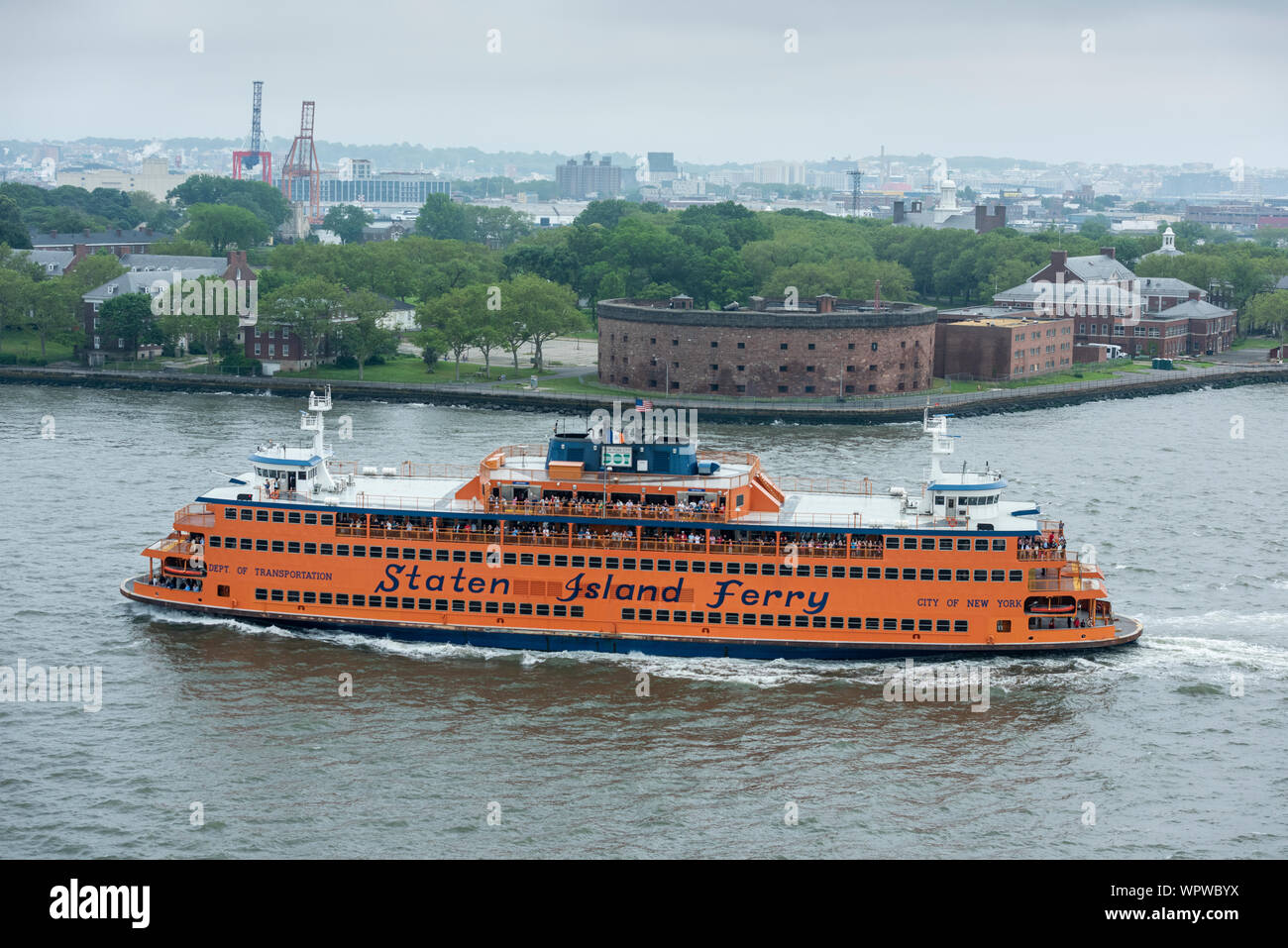 Manhattan Island bound Staten Island Ferry passing Governors Island at ...