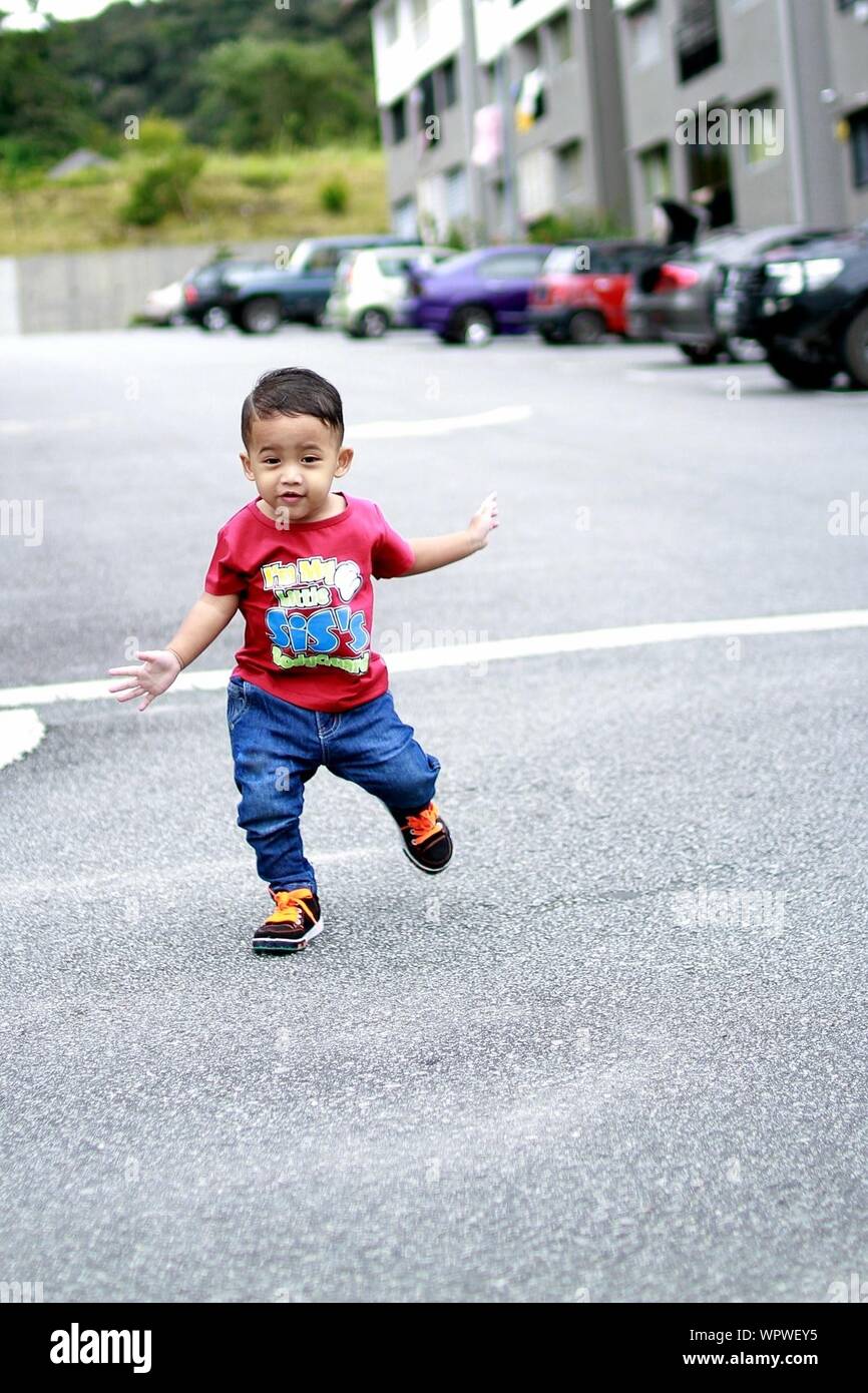 Boys running in the road hi-res stock photography and images - Alamy