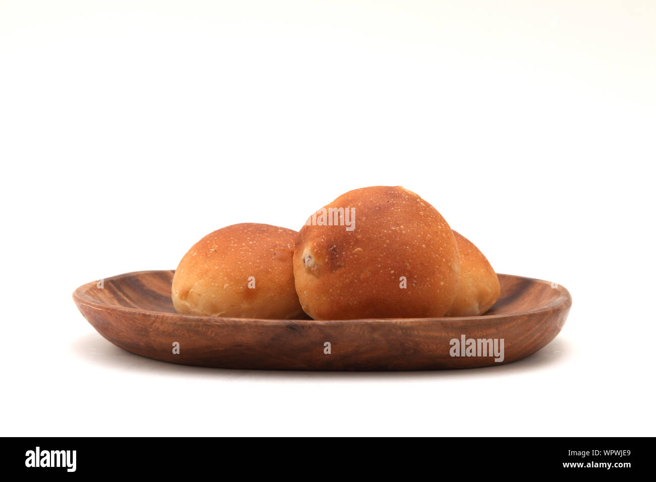 raisin butter bread table roll closeup isolated on white background ...