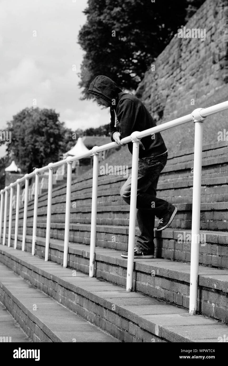 Man leaning on a railing hi-res stock photography and images - Alamy