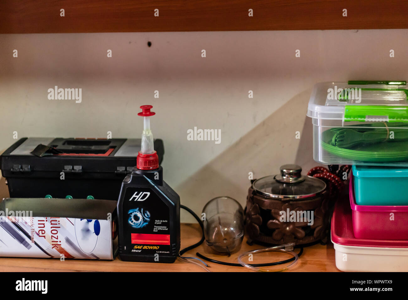 a cute tinker shelf - there is tool box and grease. photo has taken ...