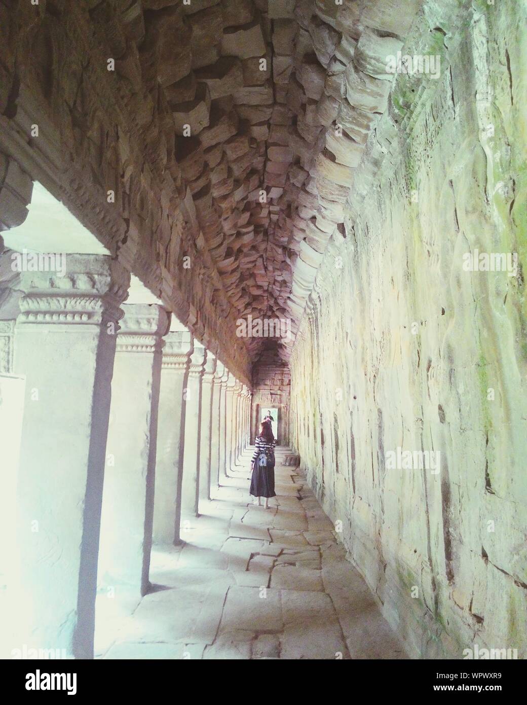 Woman standing in archway hi-res stock photography and images - Alamy