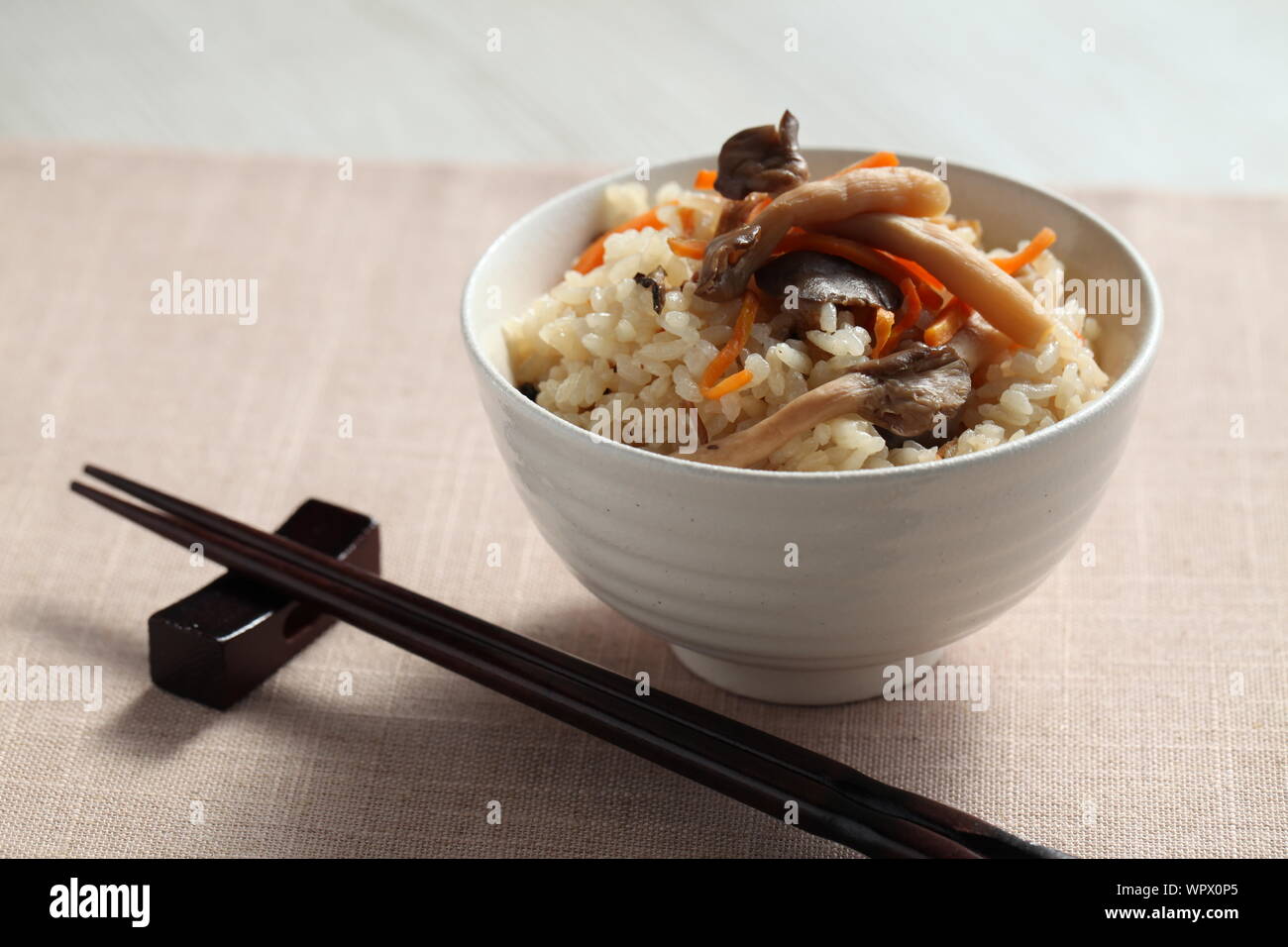 Takikomi gohan Japanese mixed rice with mushrooms closeup isolated on table Stock Photo - Alamy
