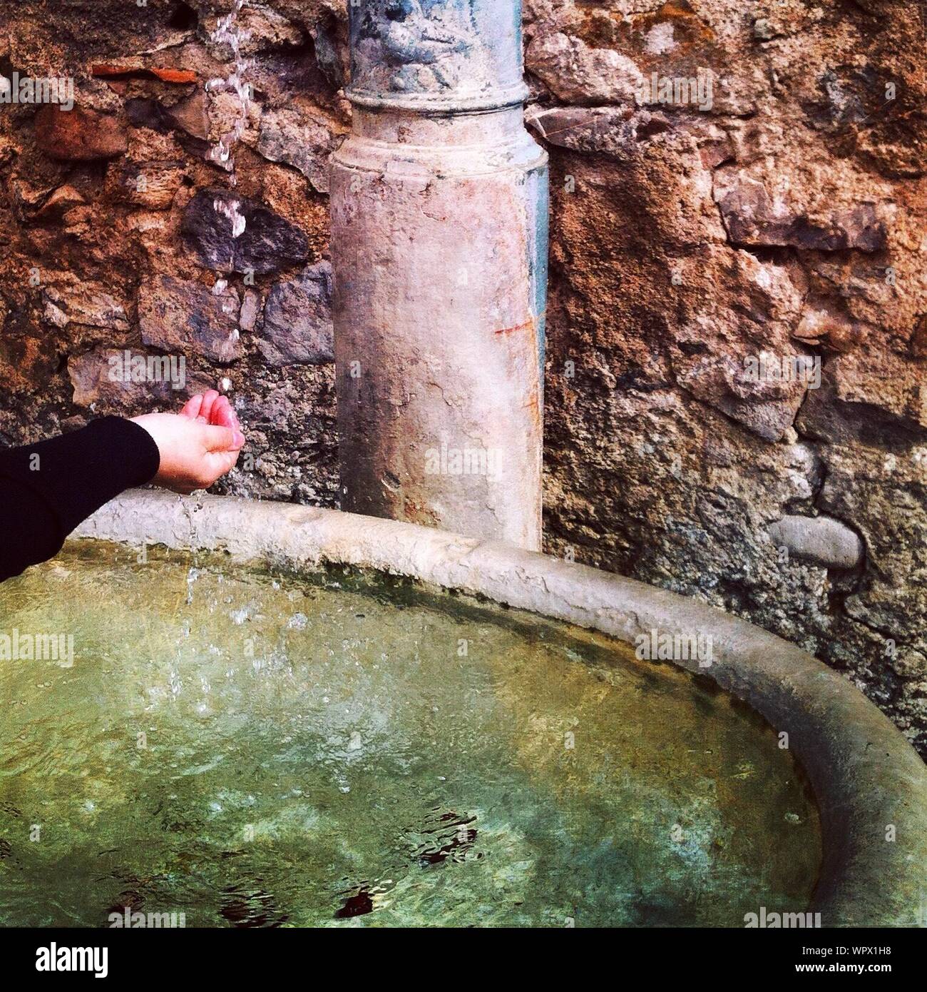 Hand touching stone hi-res stock photography and images - Alamy