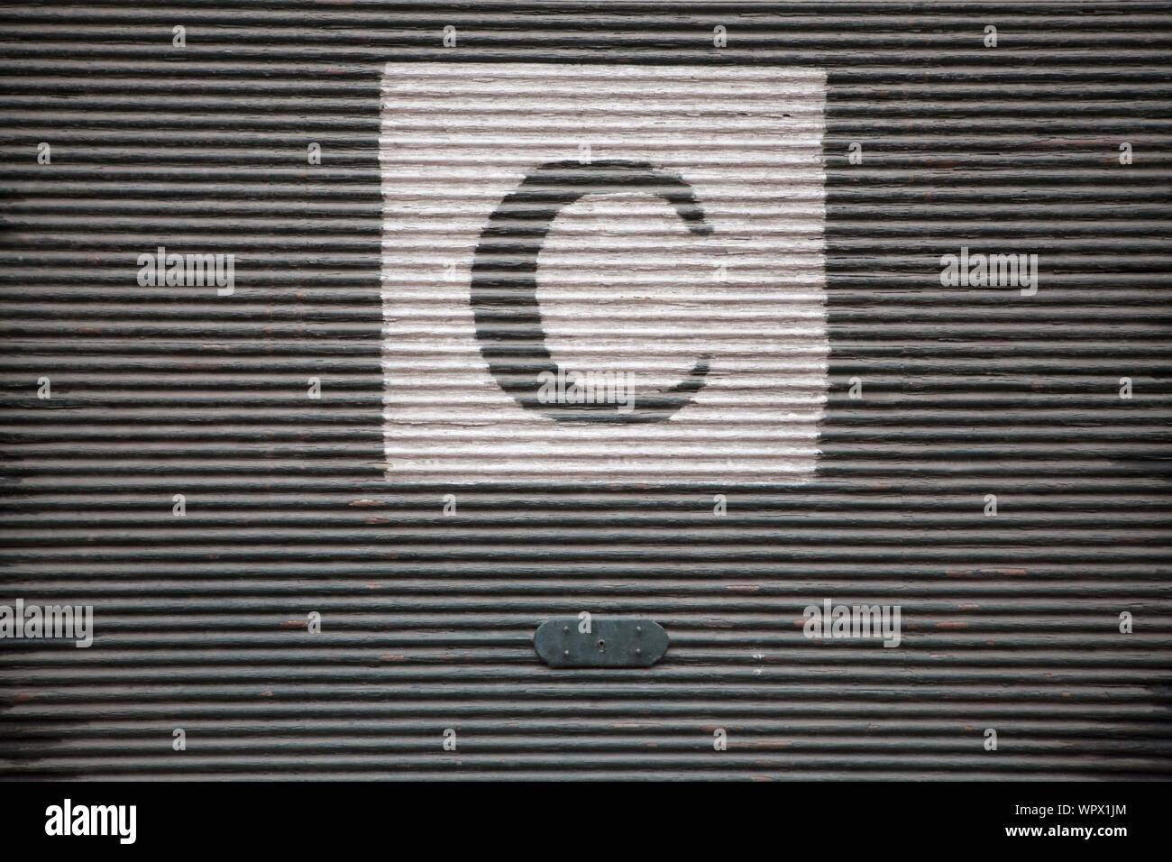 Letter C On Closed Shutter Stock Photo - Alamy