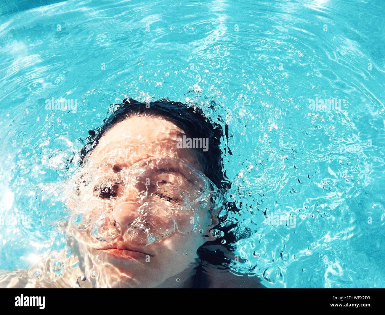 Woman swimming in swimming pool hi-res stock photography and images - Alamy