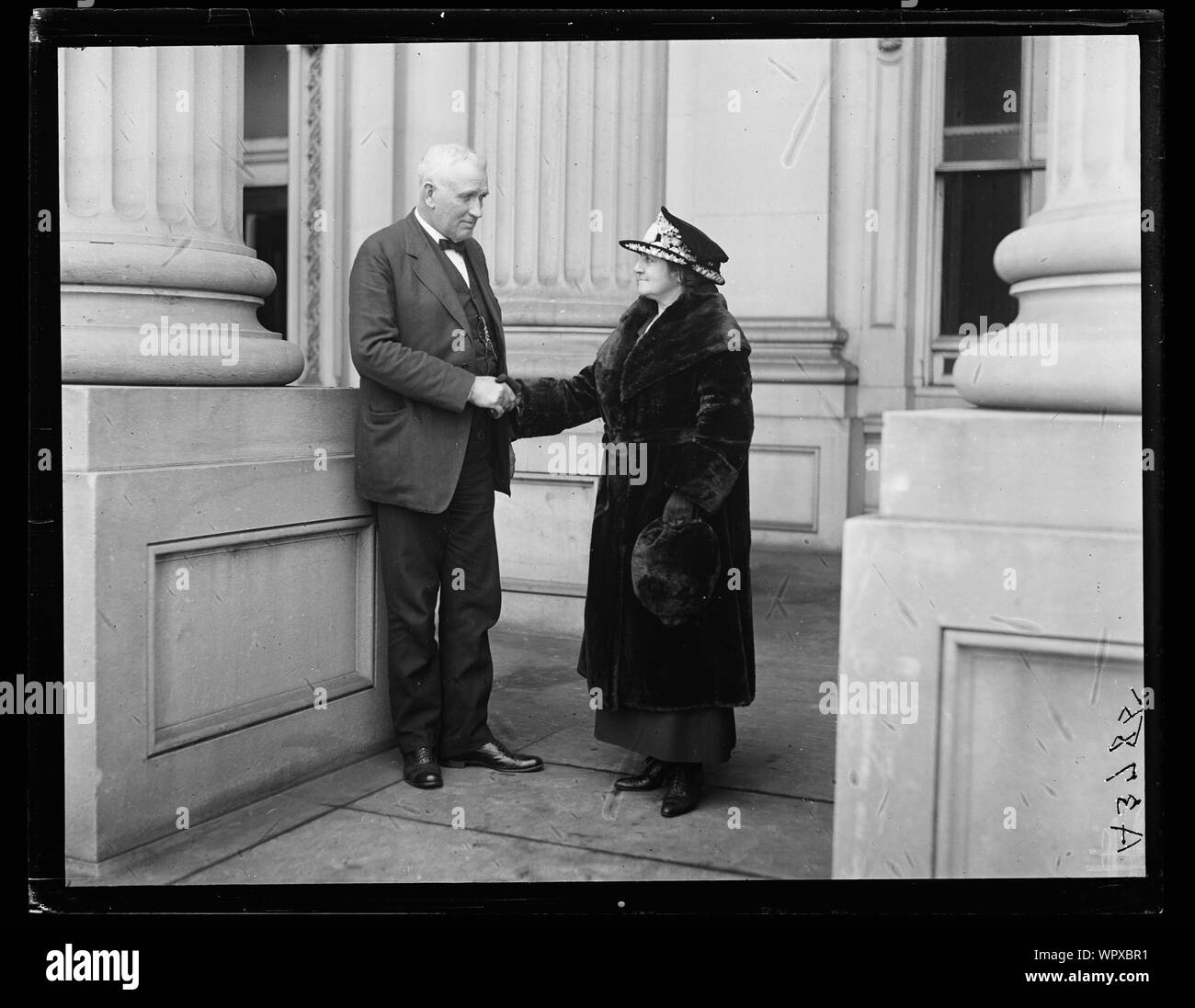 Man and woman shaking hands at U.S. Capitol, Washington, D.C Stock ...