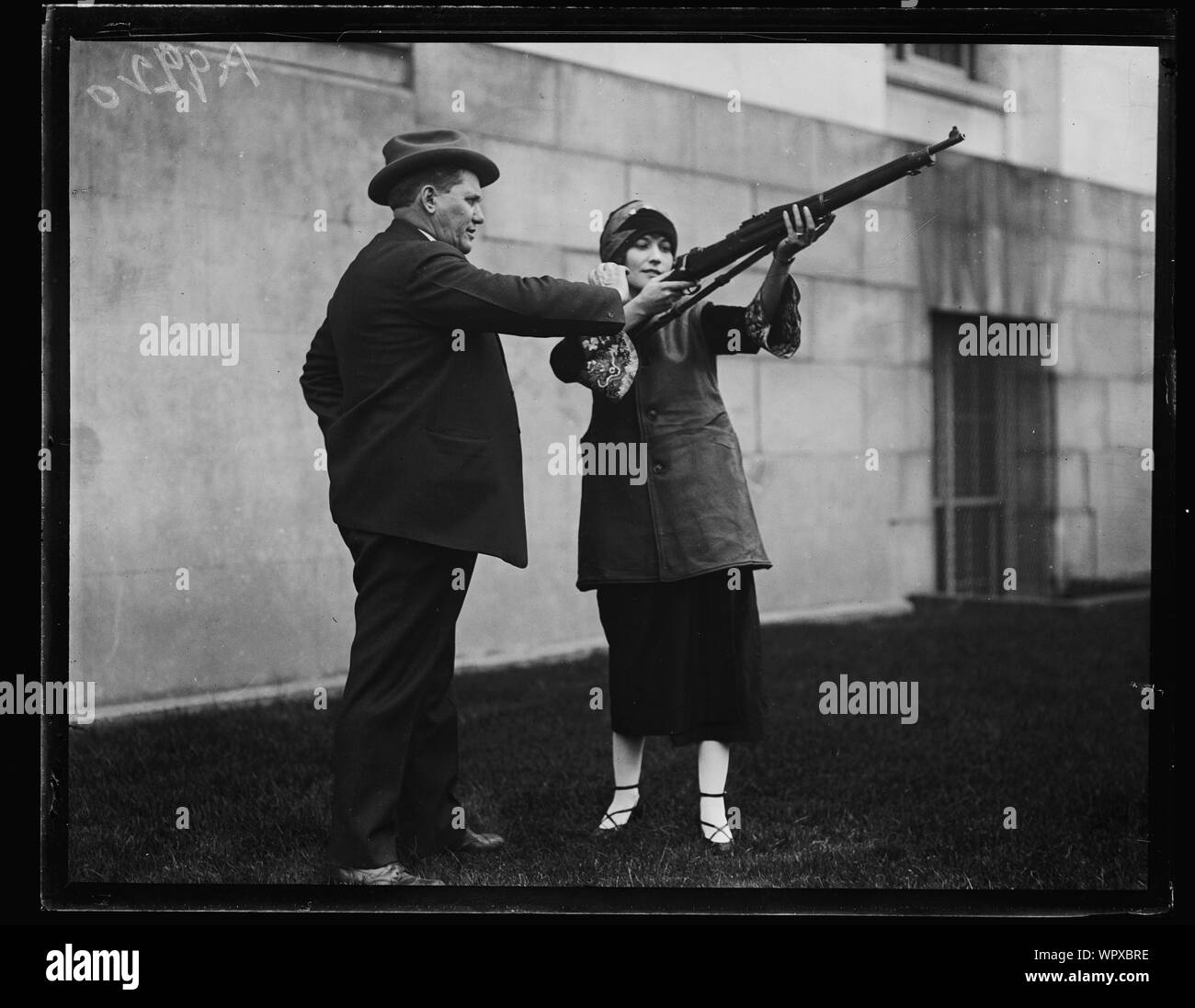 Man and woman with rifle Stock Photo - Alamy