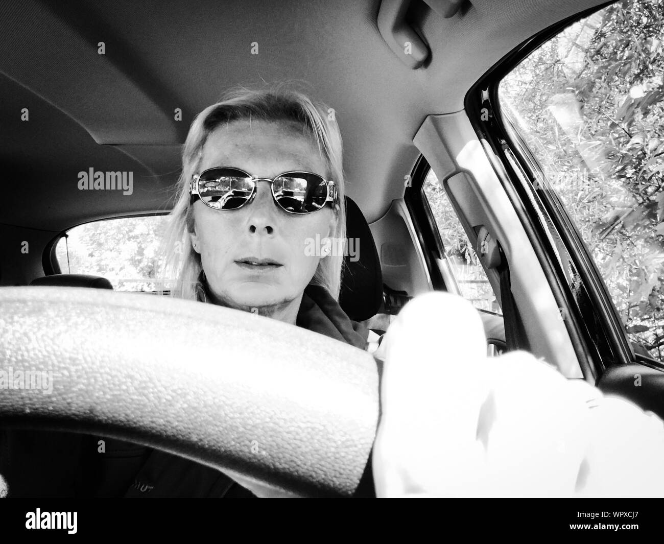 Car front view woman sitting Black and White Stock Photos & Images - Alamy