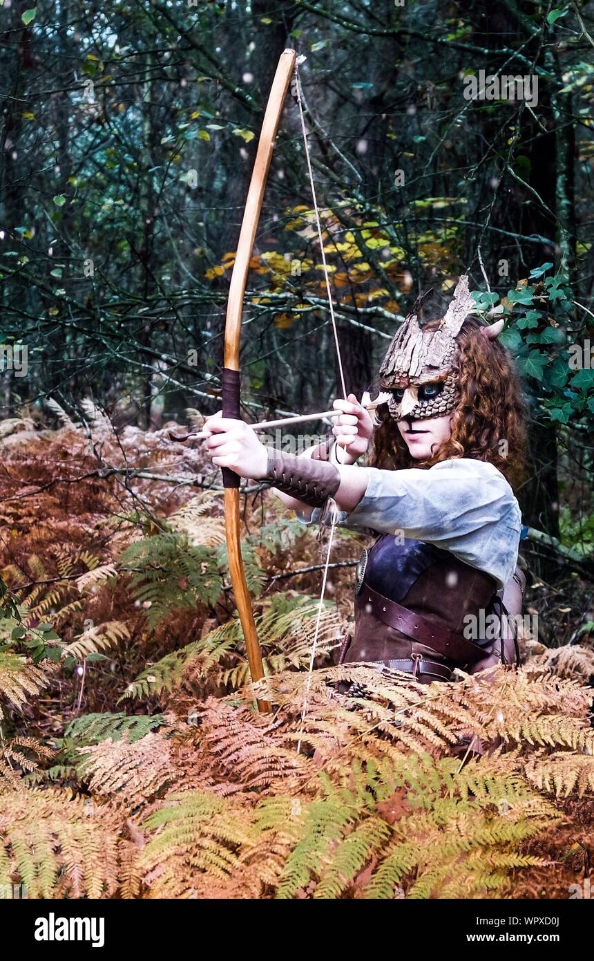 Woman Hunting Bow And Arrow High Resolution Stock Photography and ...