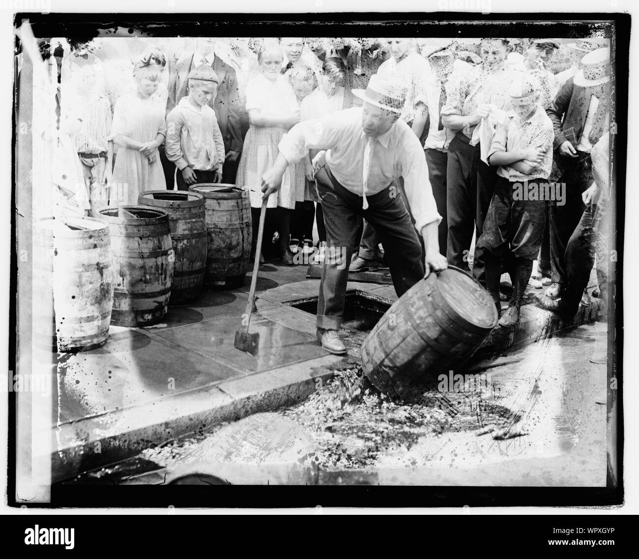 Man breaking barrels (of liquor?) into street with ax,] 7/8/21 Stock ...