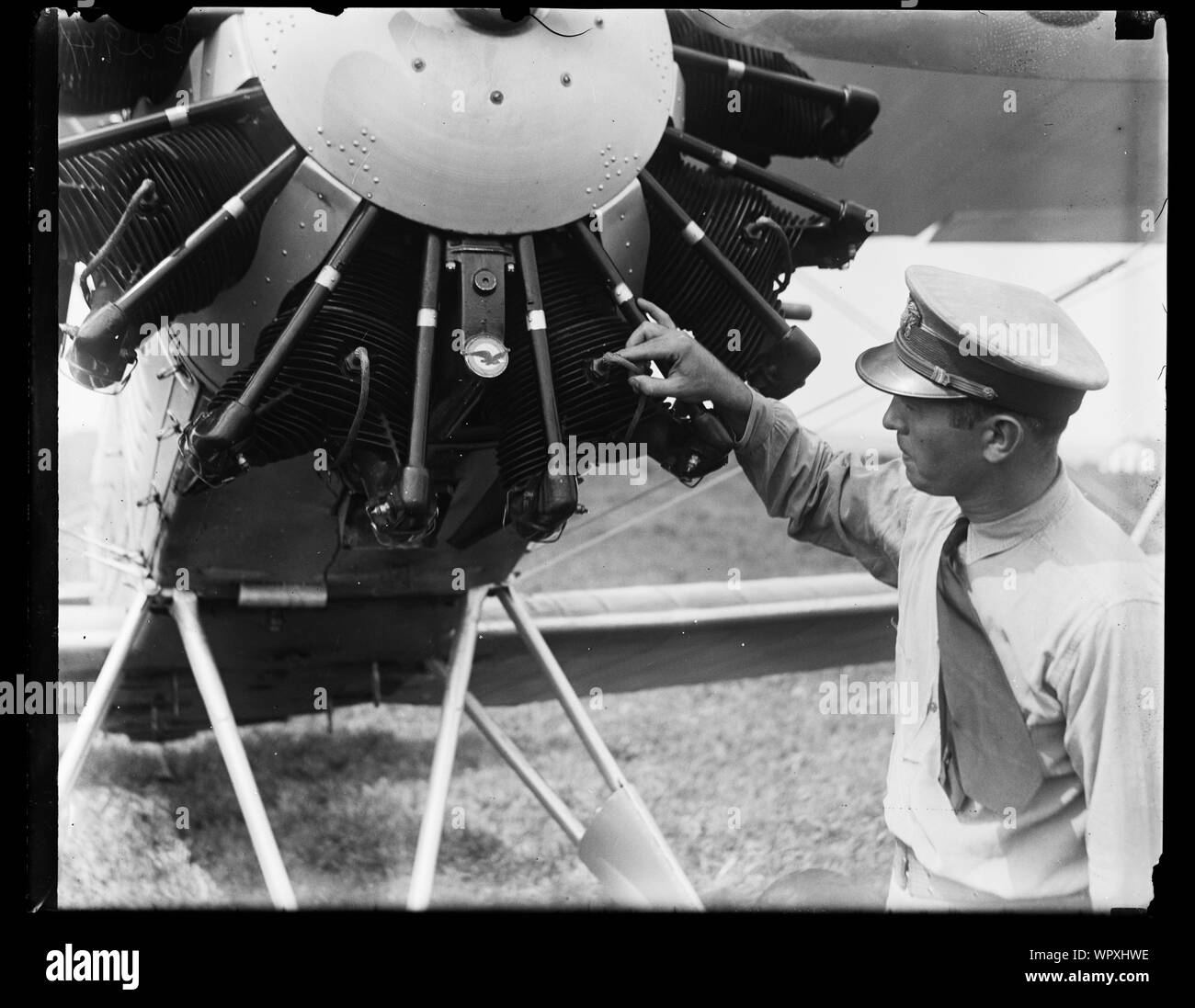 Man examining airplane propeller Stock Photo - Alamy