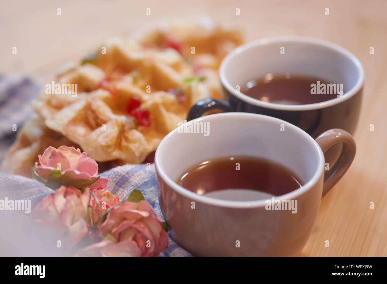 Cups of tea with waffles Stock Photo - Alamy