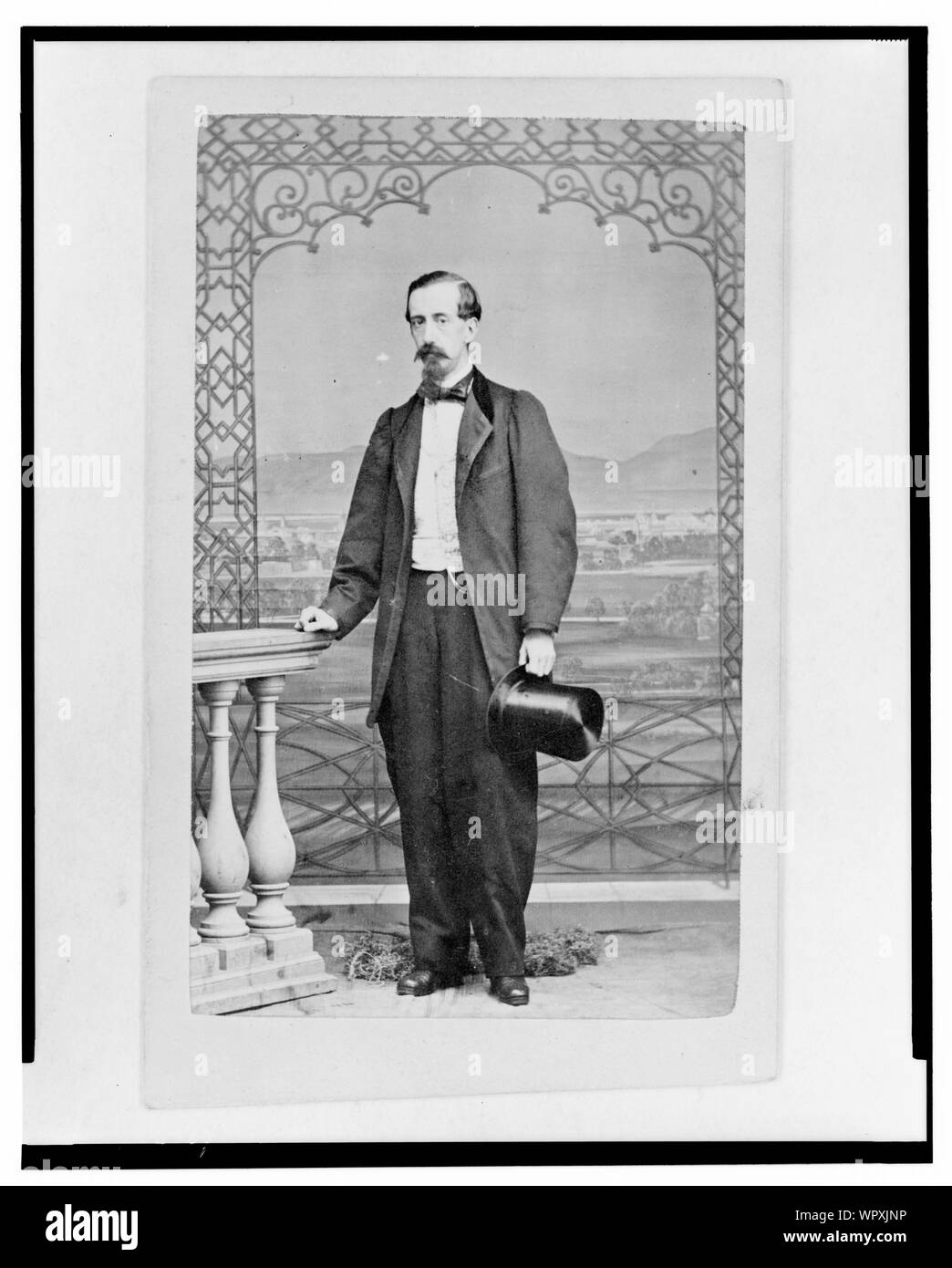 Man holding top hat, full-length portrait, standing, facing front Stock ...