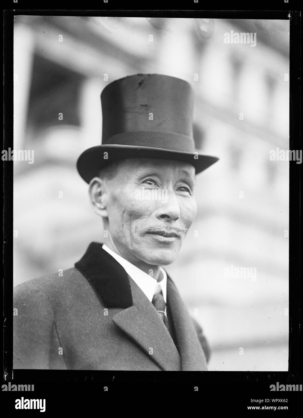 Facade building man standing hi-res stock photography and images - Alamy