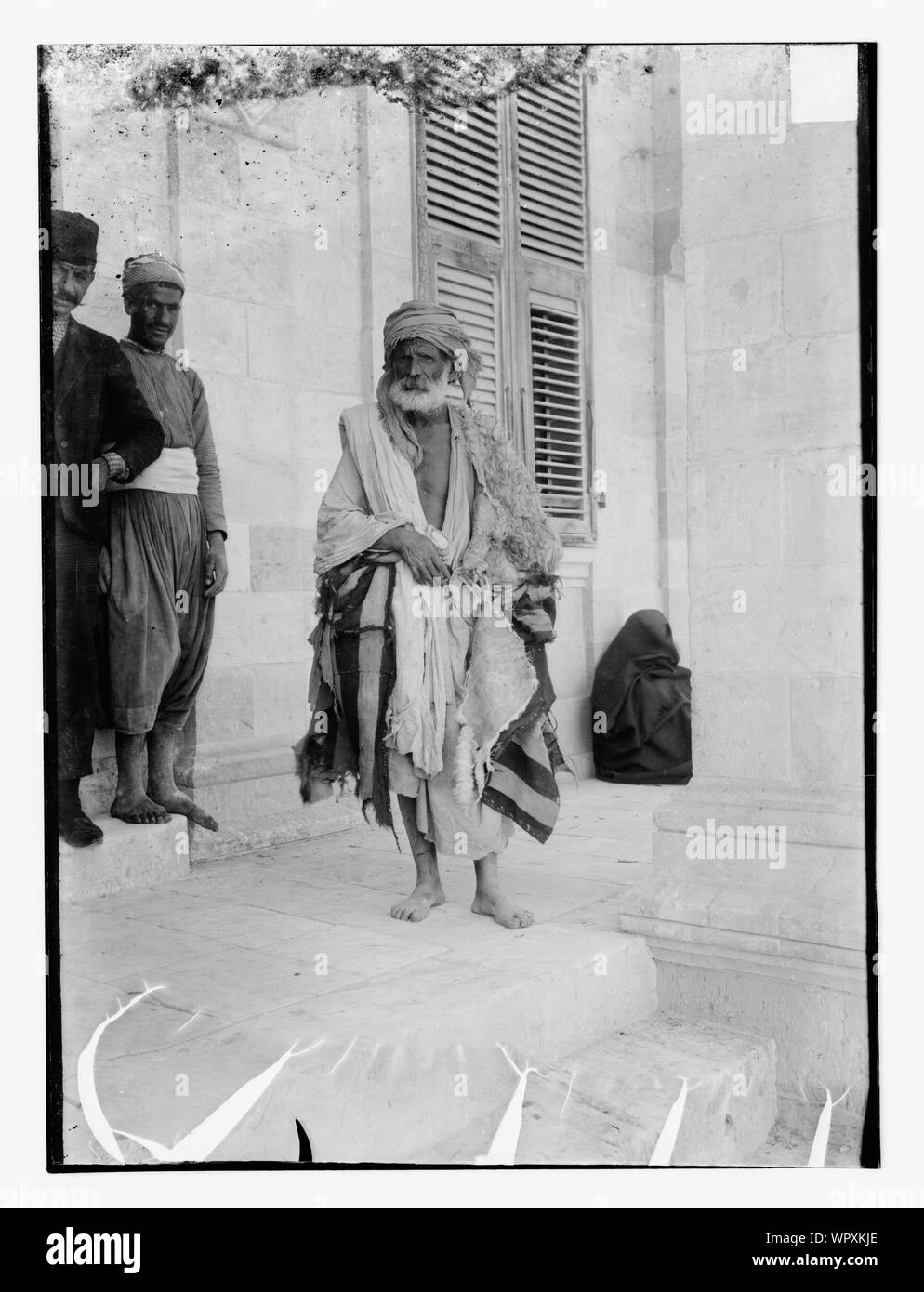 Man in robes with two other men on steps of a building Stock Photo - Alamy