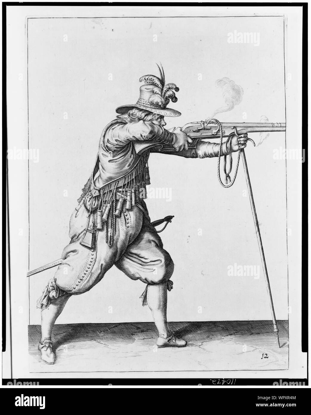 Man shooting rifle resting on support Stock Photo - Alamy