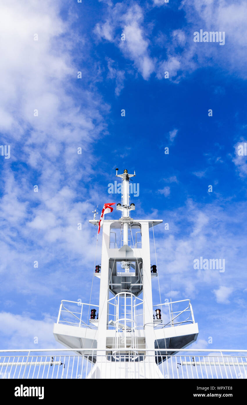 White ship navigation and communication tower mast, rear view from ...