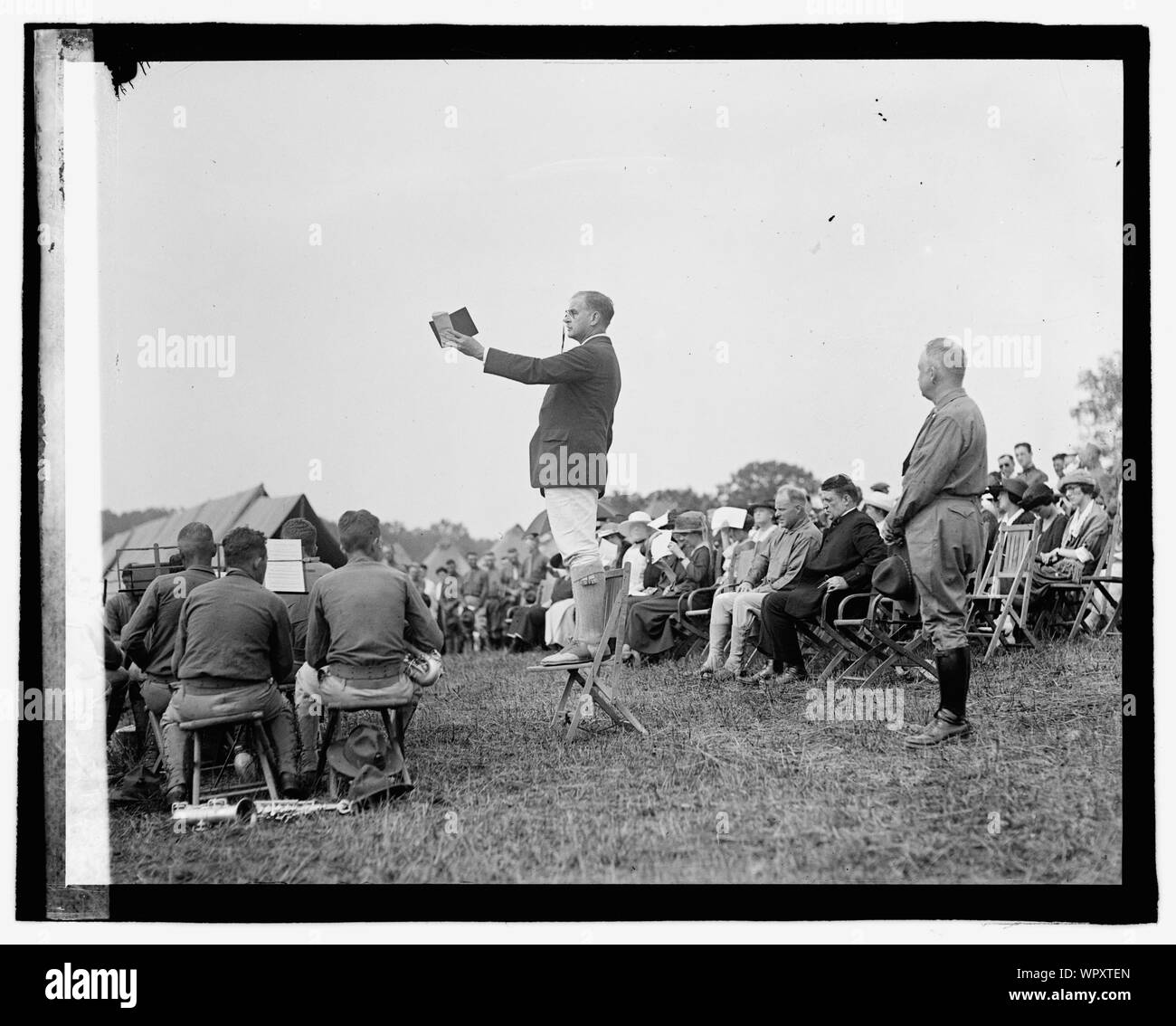 Standing on chair Black and White Stock Photos & Images - Alamy
