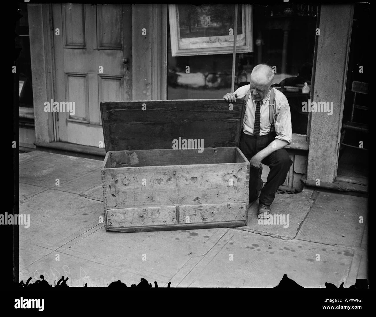 Man with antique wooden chest Stock Photo - Alamy