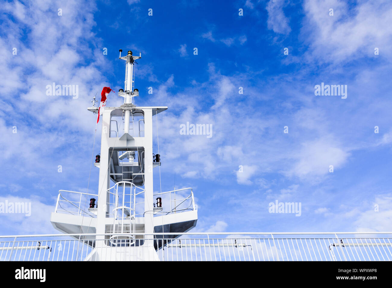 White ship navigation and communication tower mast, rear view from ...
