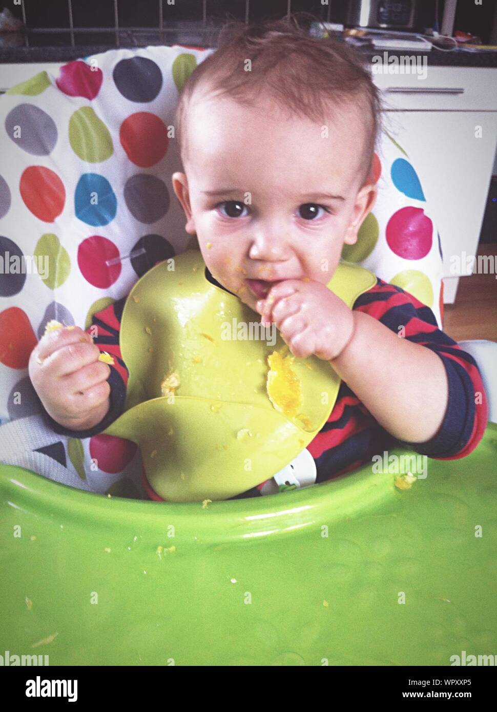 Boy chair eating hi-res stock photography and images - Alamy