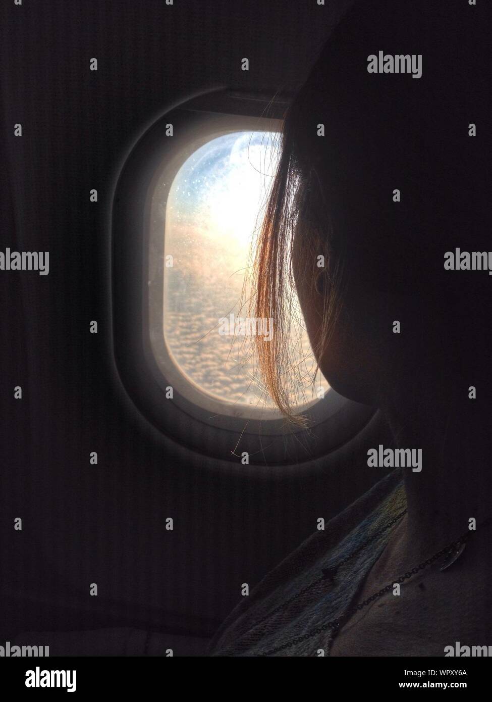 Passenger looking out window hi-res stock photography and images - Alamy