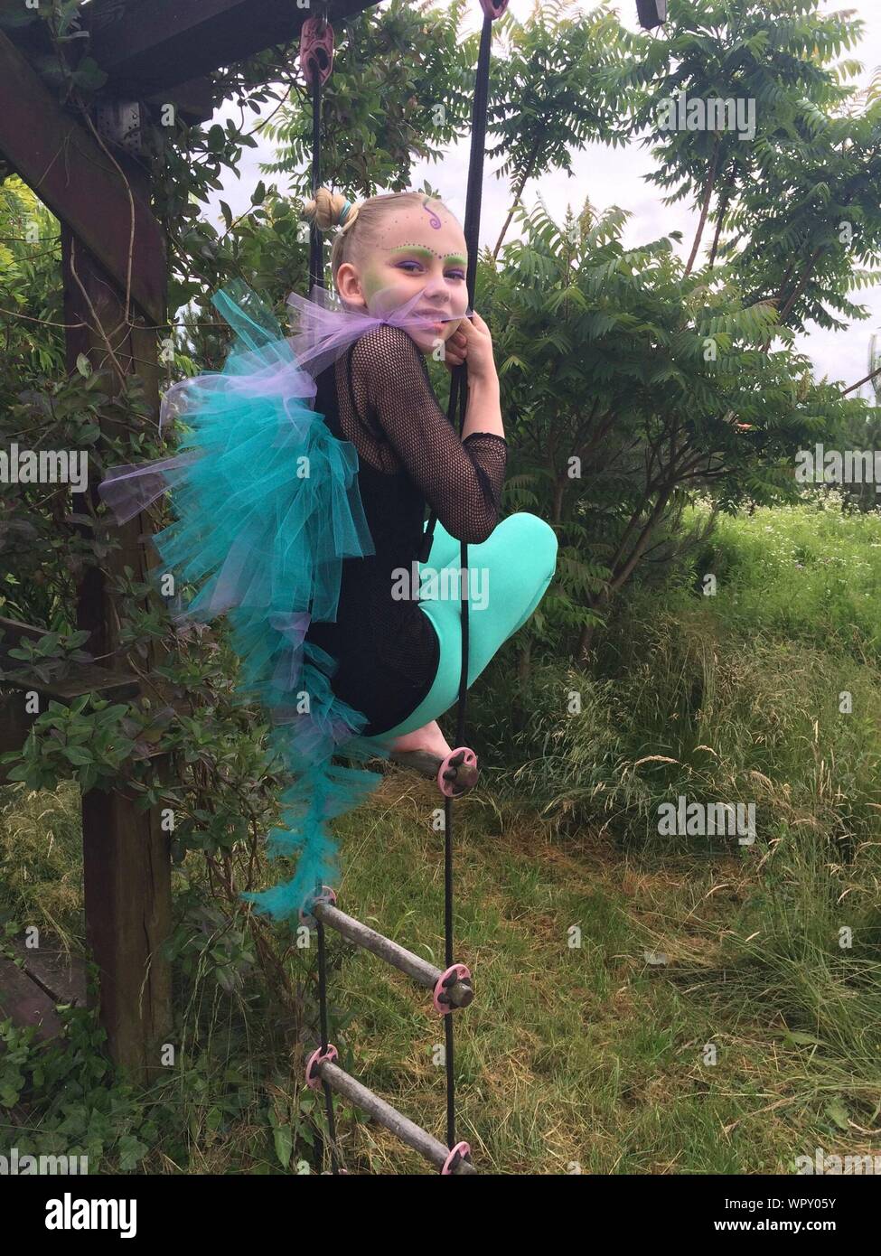 Portrait Of Girl On Rope Ladder Stock Photo - Alamy