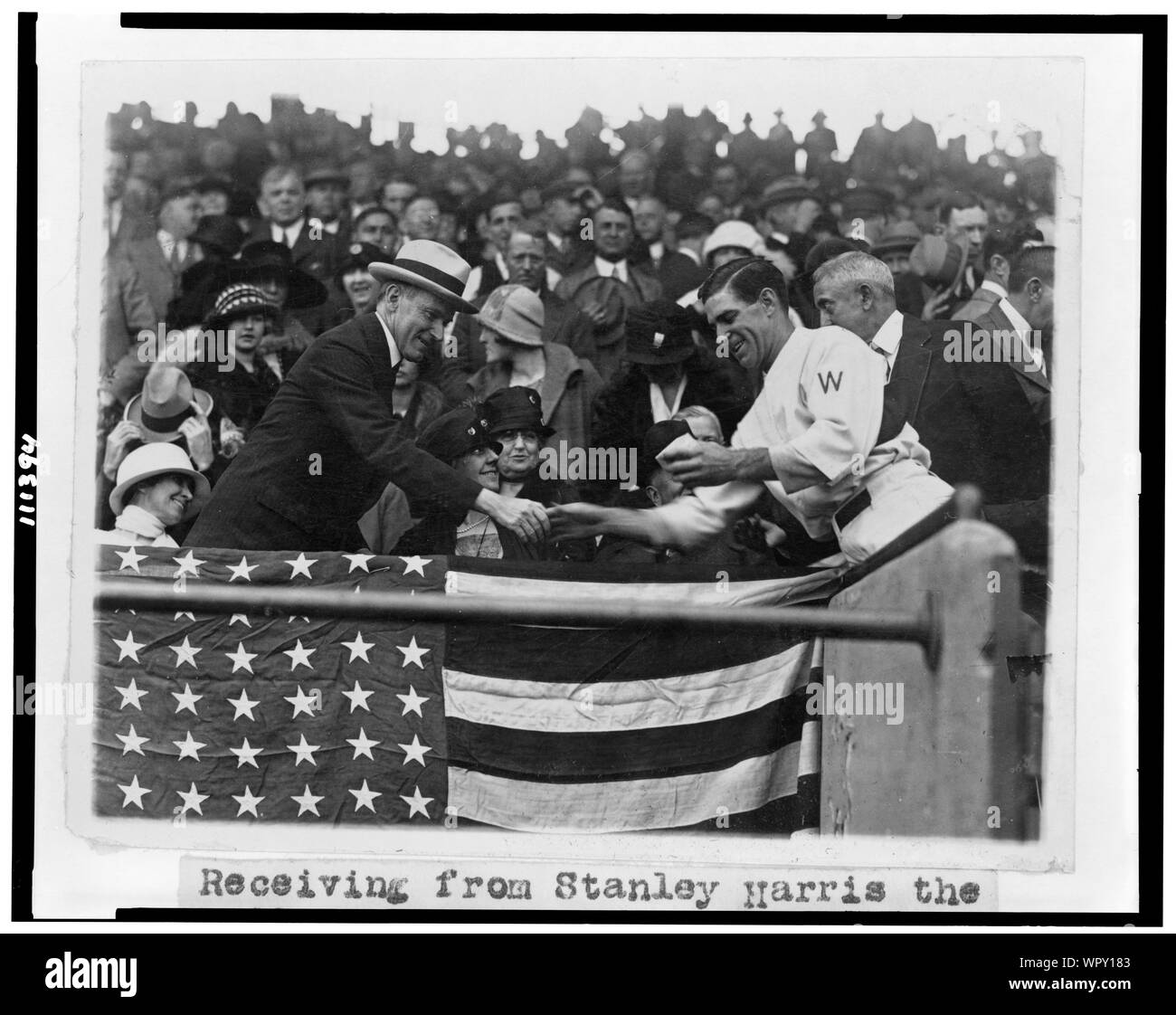 Manager Stanley Harris, in the grandstand, presents President Coolidge ...