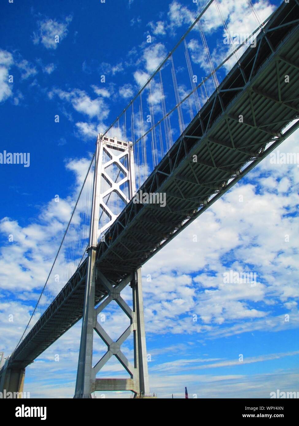 Bridge with blue sky and clouds hi-res stock photography and images - Alamy