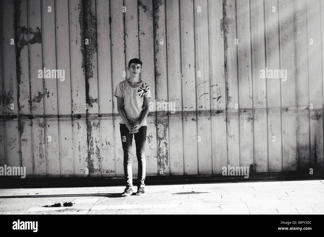 Boy wall standing shadow hi-res stock photography and images - Alamy