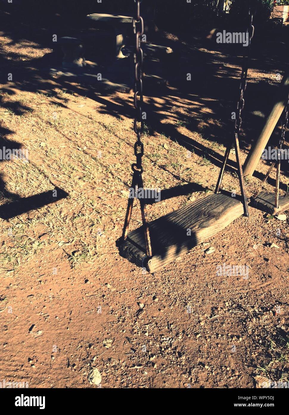 Empty swing playground hi-res stock photography and images - Alamy