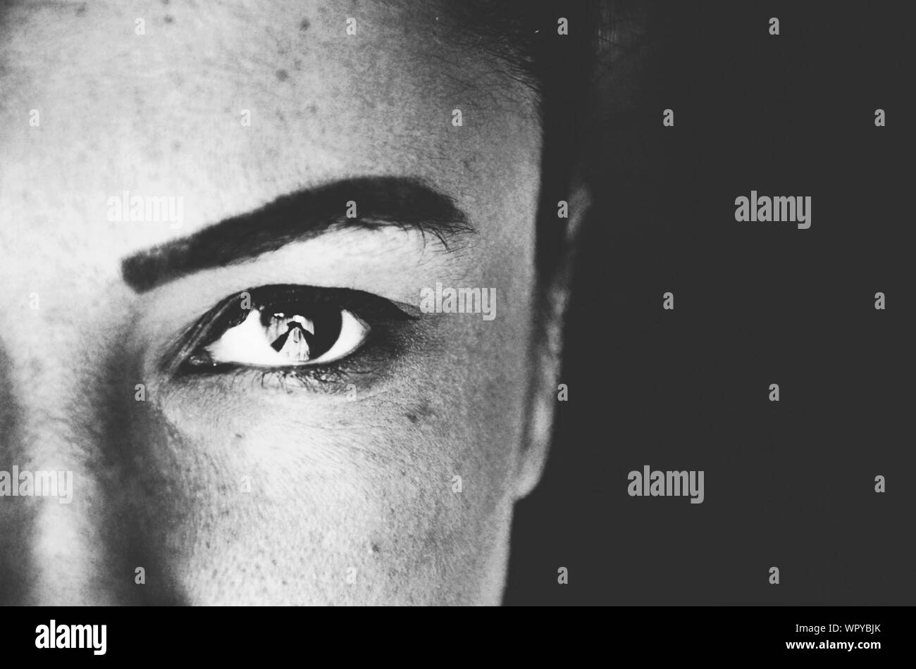 Human eye macro iris black background Black and White Stock Photos ...
