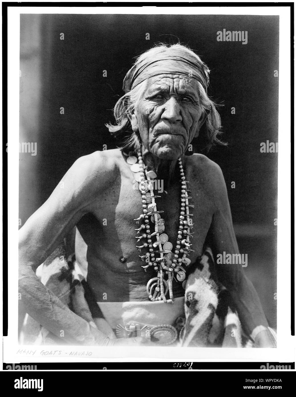 Many Goats, Navajo Indian, half-length portrait, seated, facing ...
