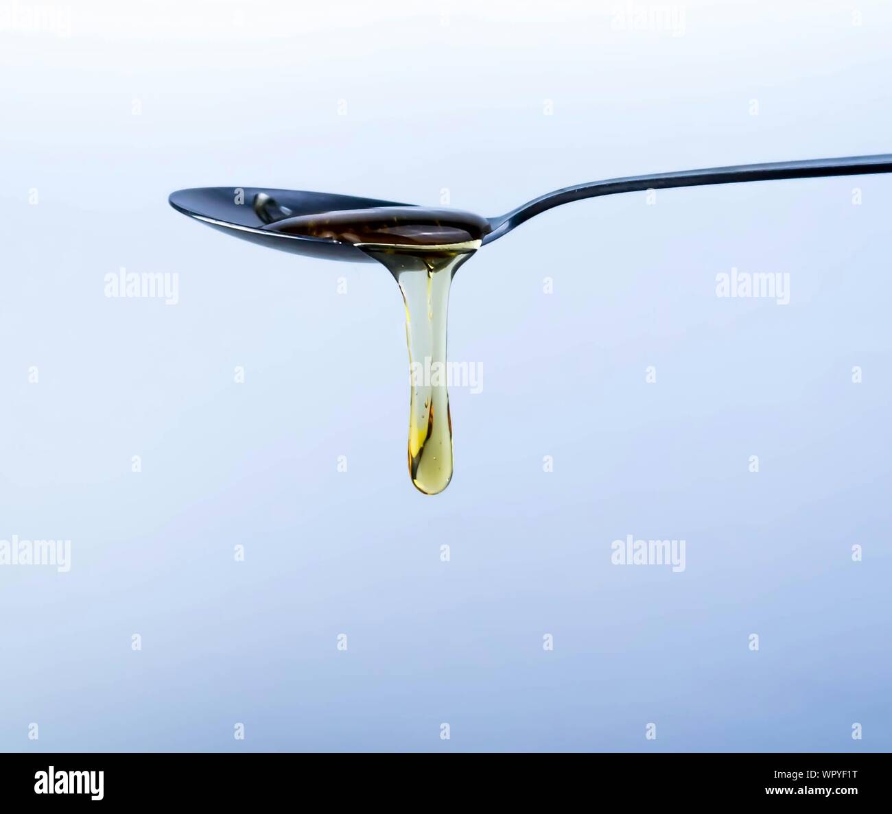 Dripping honey spoon hi-res stock photography and images - Alamy