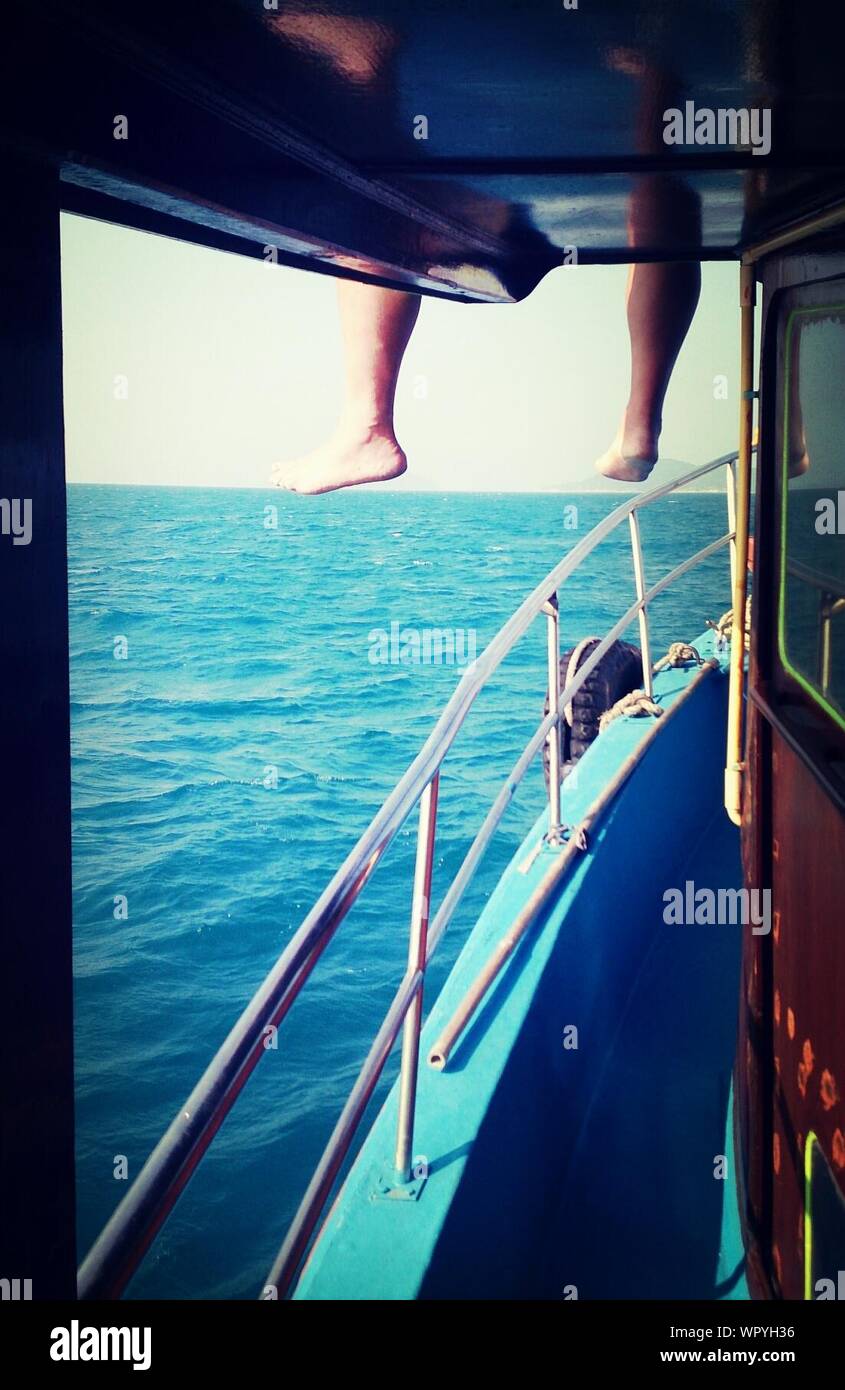 Women dangling legs hi-res stock photography and images - Alamy