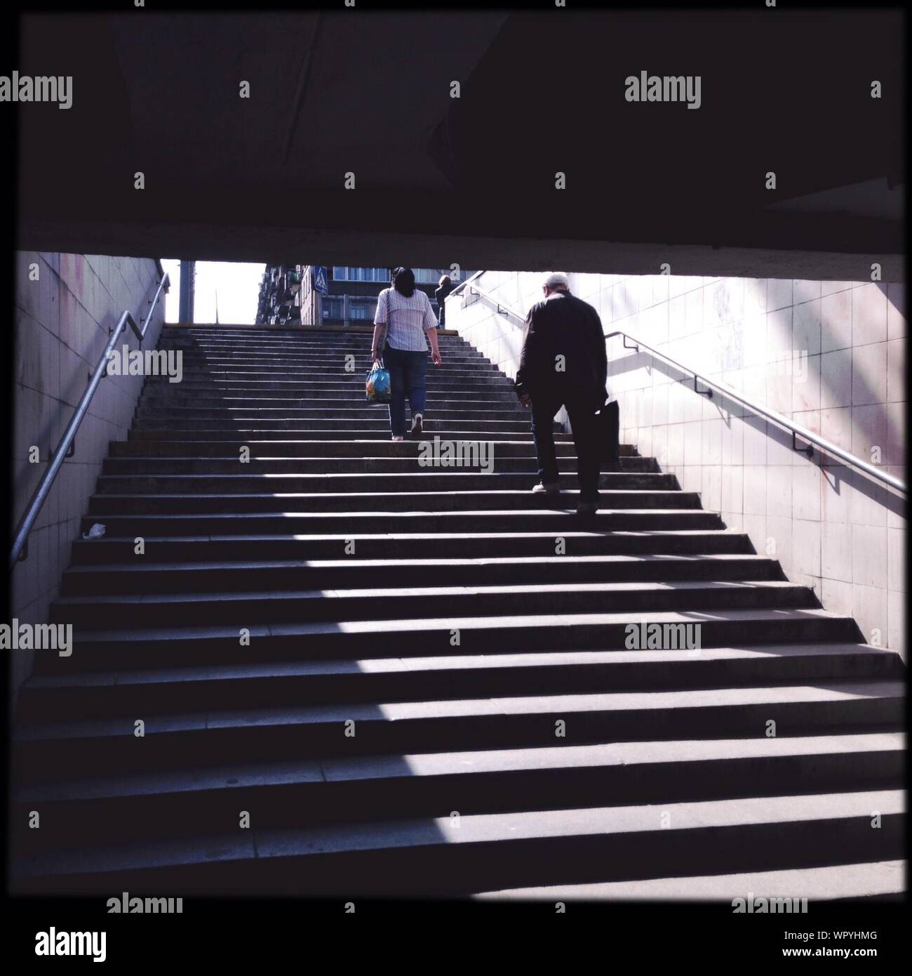 People climbing stairs hi-res stock photography and images - Alamy