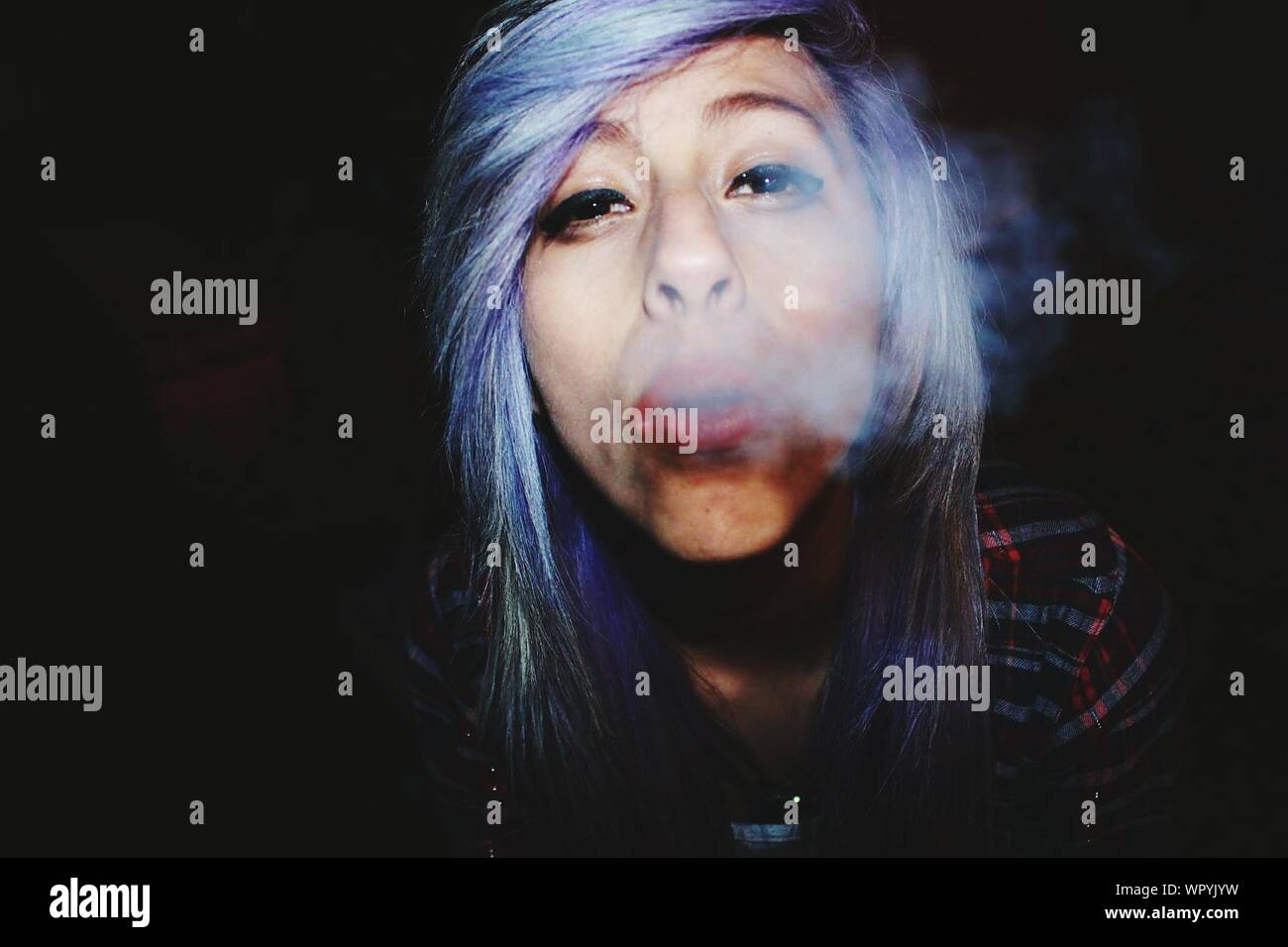 Woman smoke hair hi-res stock photography and images - Alamy