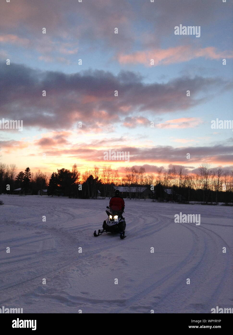 Man on snowmobile in winter hi-res stock photography and images - Alamy