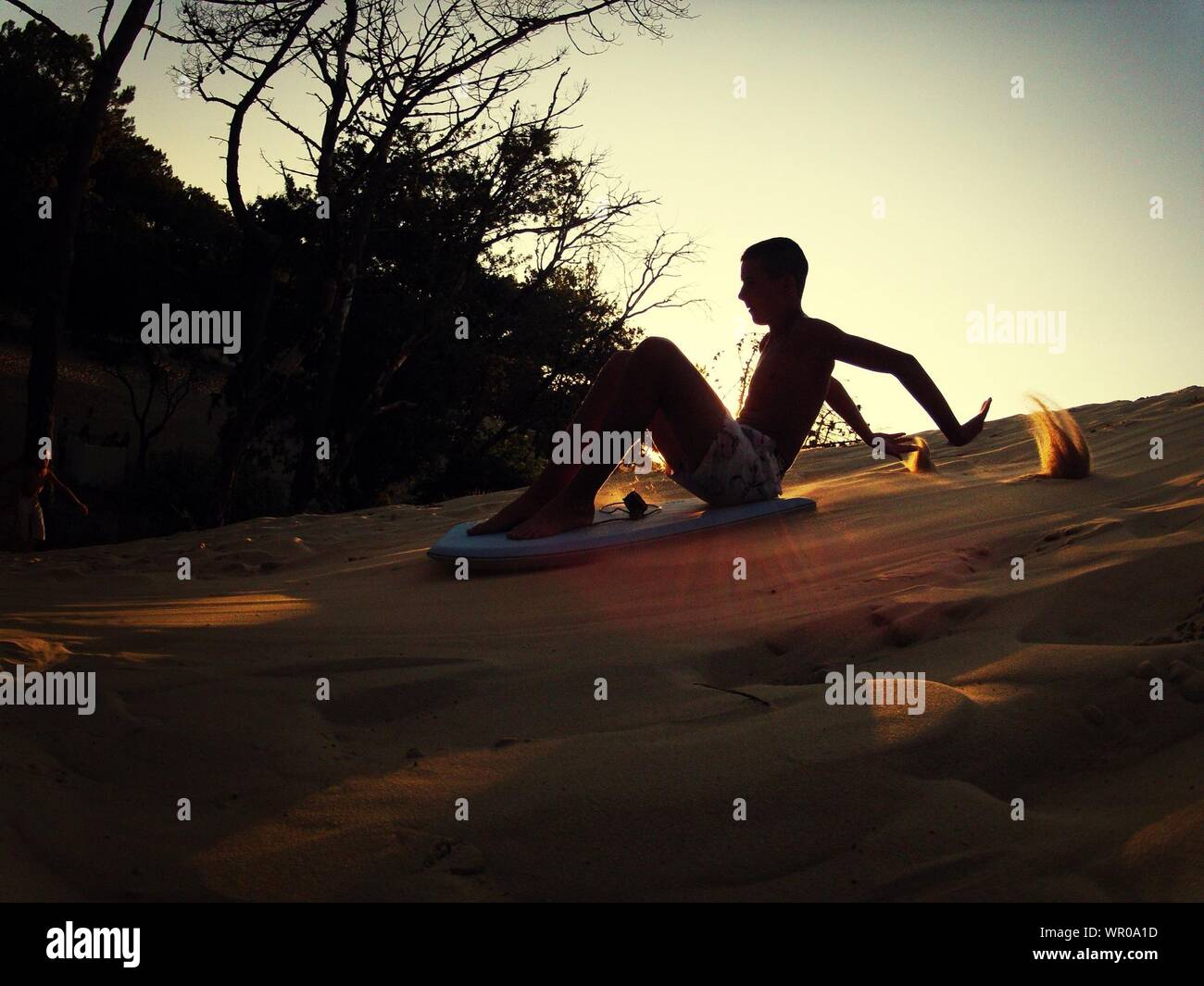 Boy sliding hi-res stock photography and images - Alamy