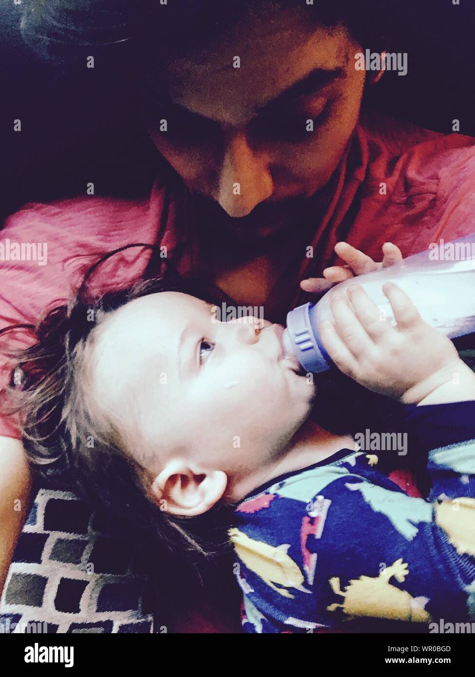 Parent drinking baby bottle hi-res stock photography and images - Alamy