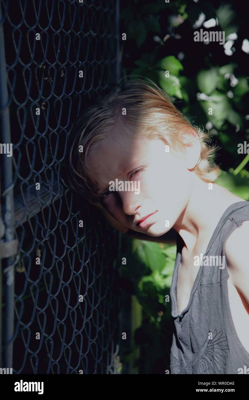 Boy Leaning On Fence High Resolution Stock Photography and Images - Alamy