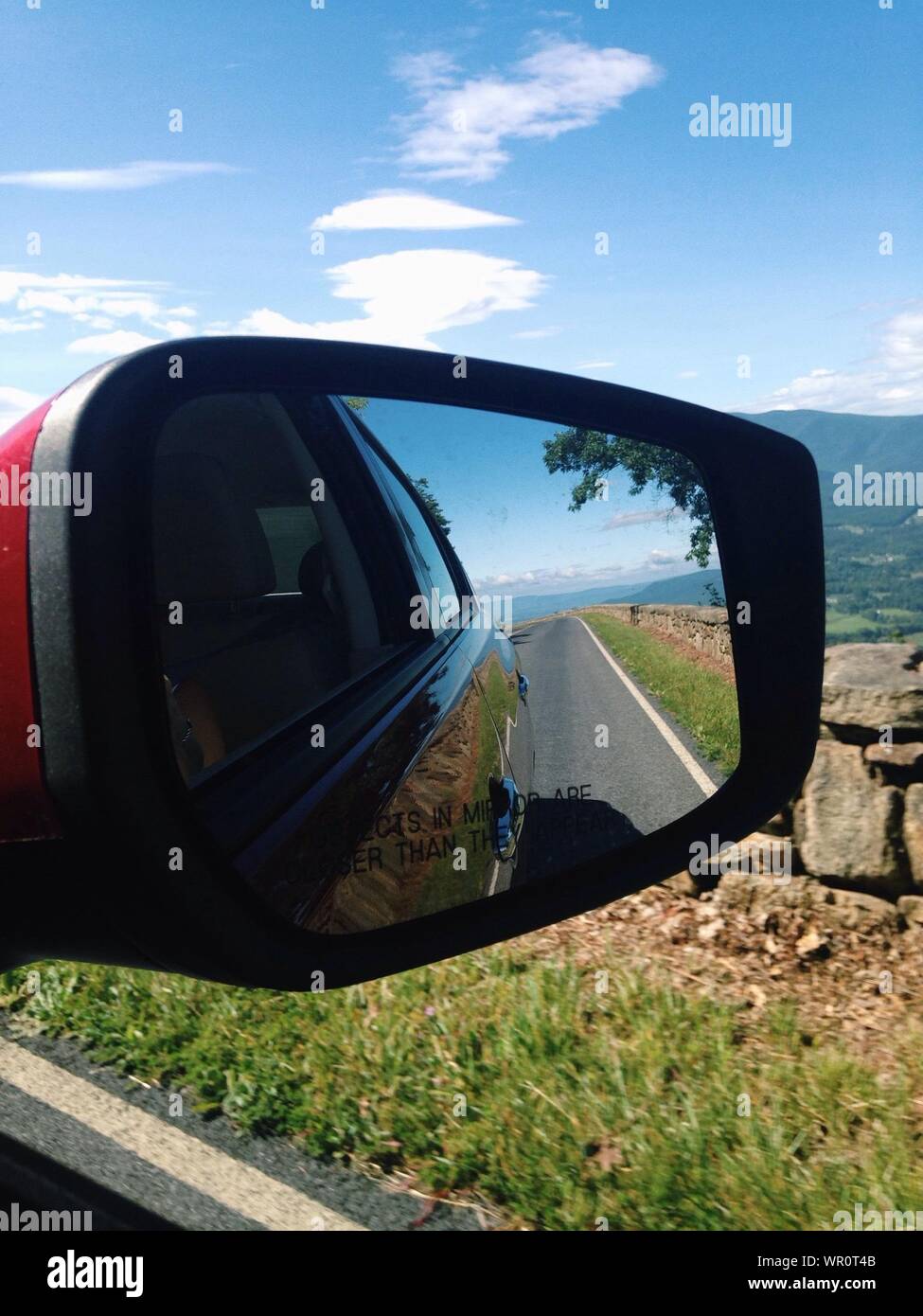 View Of Road In The Mirror Of A Car Stock Photo - Alamy