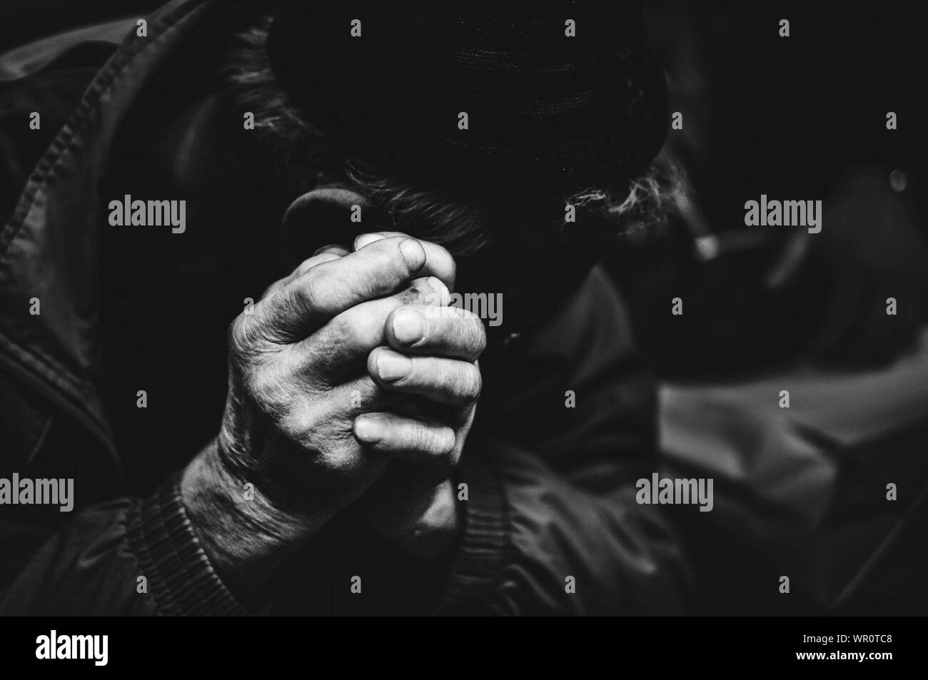 Man praying hands hi-res stock photography and images - Alamy