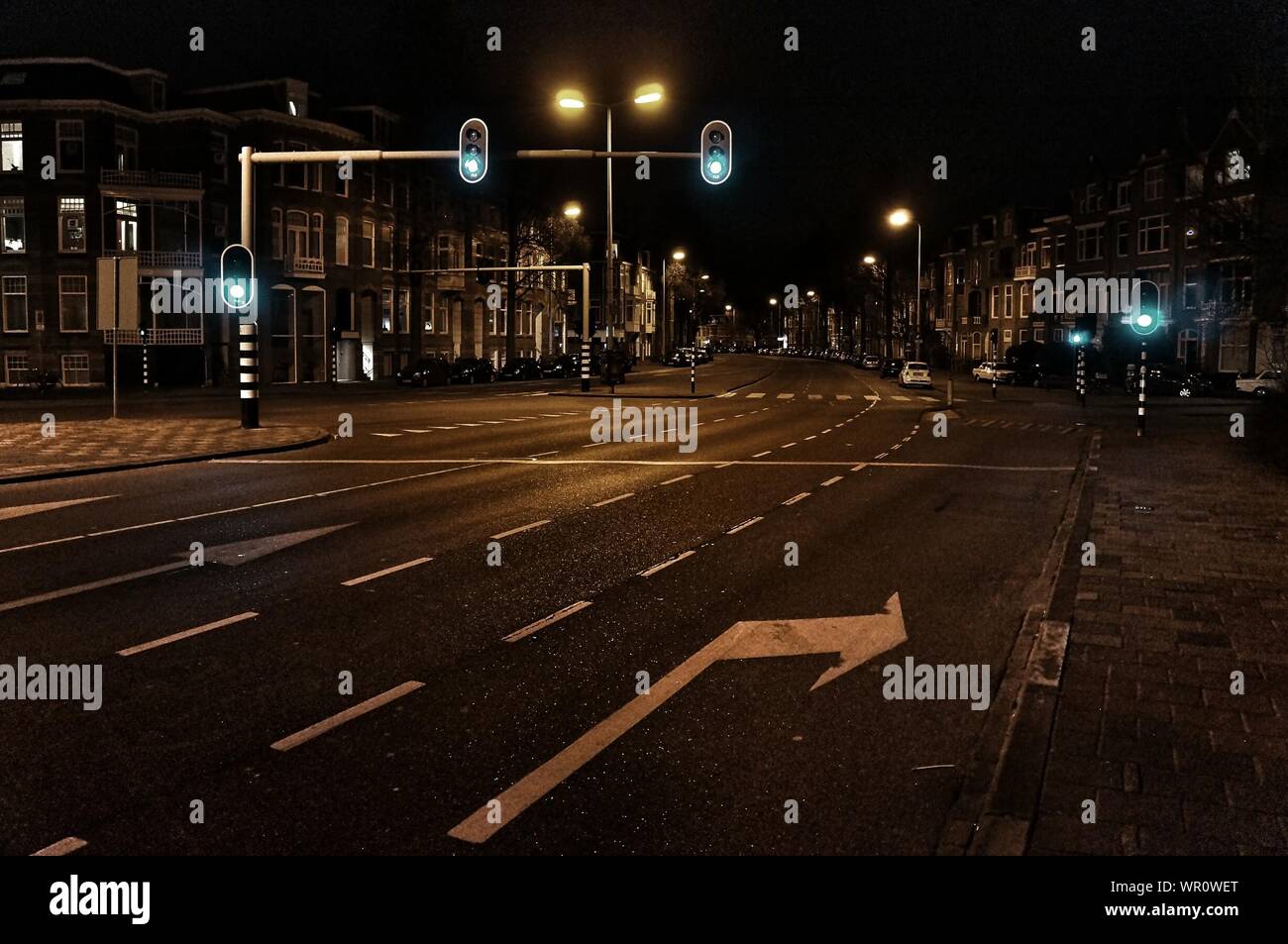 View Of Street Lights And Signs At Night Stock Photo - Alamy