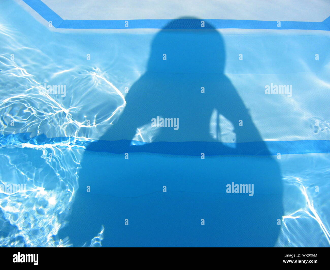 Shadow Of Person On Swimming Pool Stock Photo - Alamy