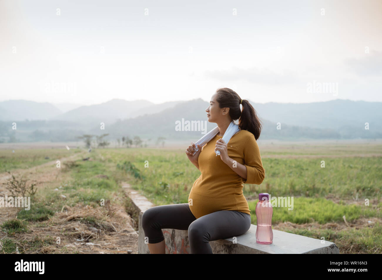 maternity woman take a break after workout outdoor Stock Photo - Alamy